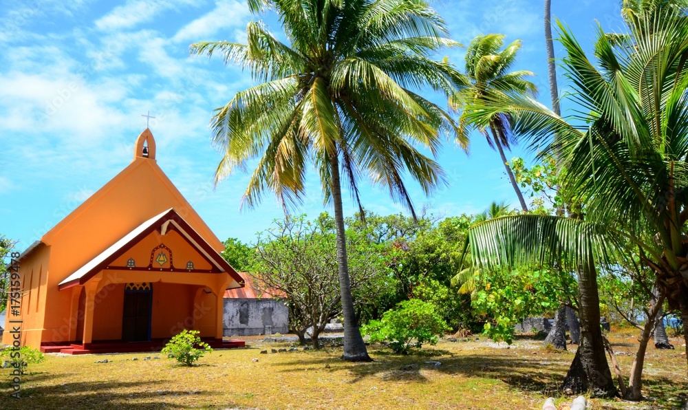 Church on the beach surronded by coconut trees in Fakarava island ...