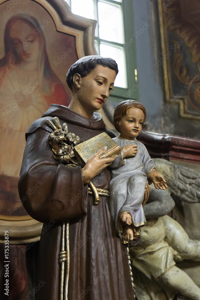 Saint Anthony of Padua holding baby Jesus statue with lily flower ...