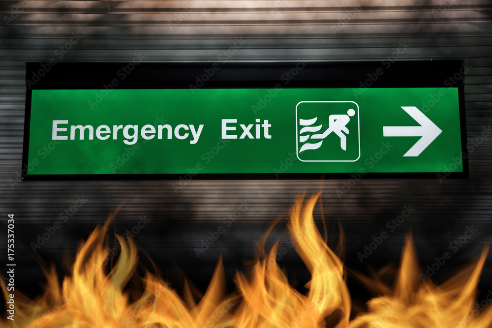 Emergency exit sign green color with light and arrow pointing to exit ...