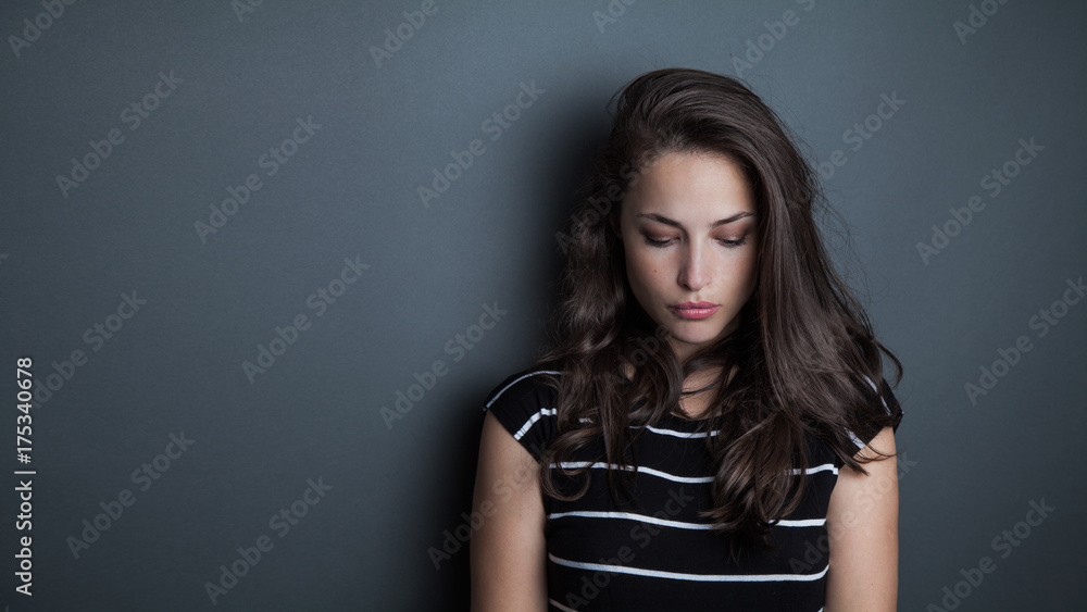 young beautiful pensive woman portrait studio Stock Photo | Adobe Stock