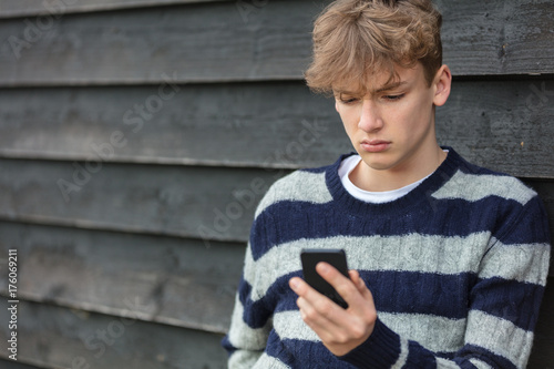 Sad Depressed Boy Male Child Teenager Using Mobile Cell Phone - Buy ...