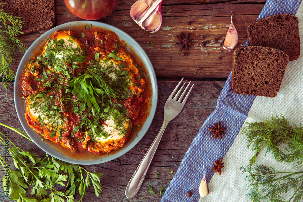 Shakshuka - jewish traditional recipe. Breakfast with fried eggs ...