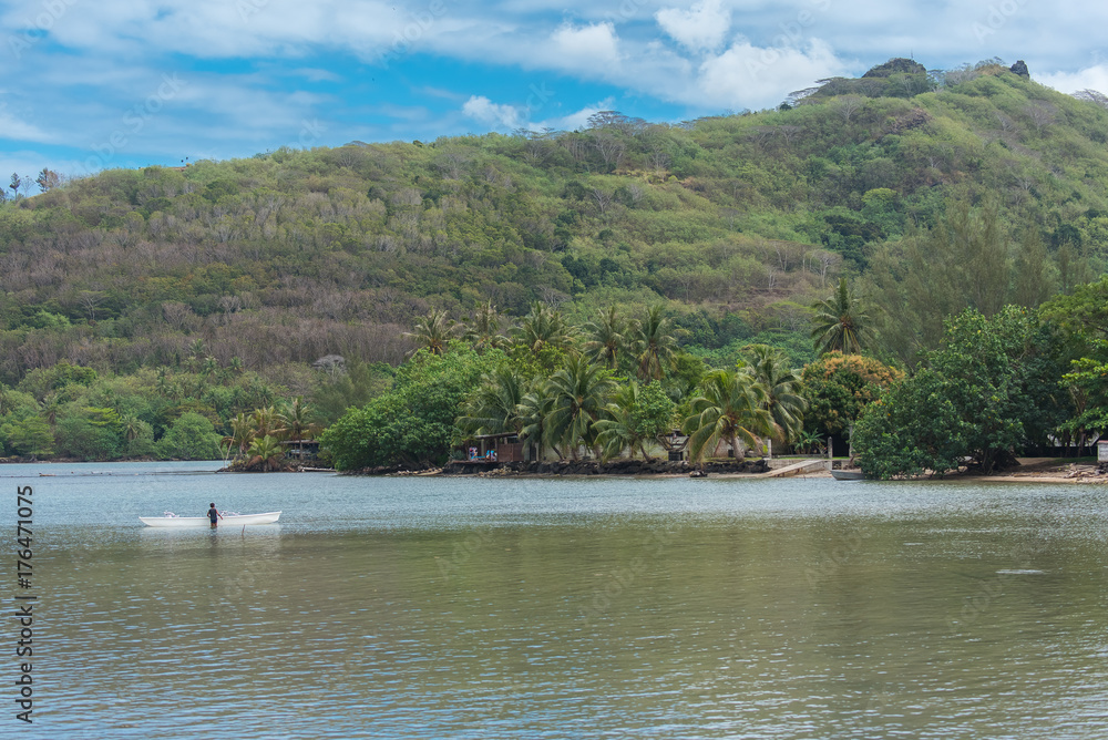 Moorea in Polynesia, beautiful panorama of the lagoon, with a young boy ...