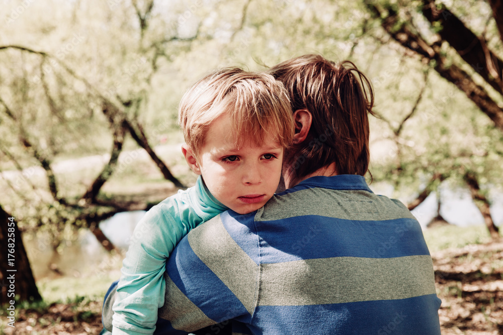 Sad crying son hugging father Stock Photo | Adobe Stock