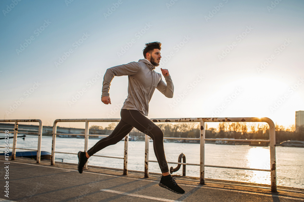 Man running outside. Stock Photo | Adobe Stock