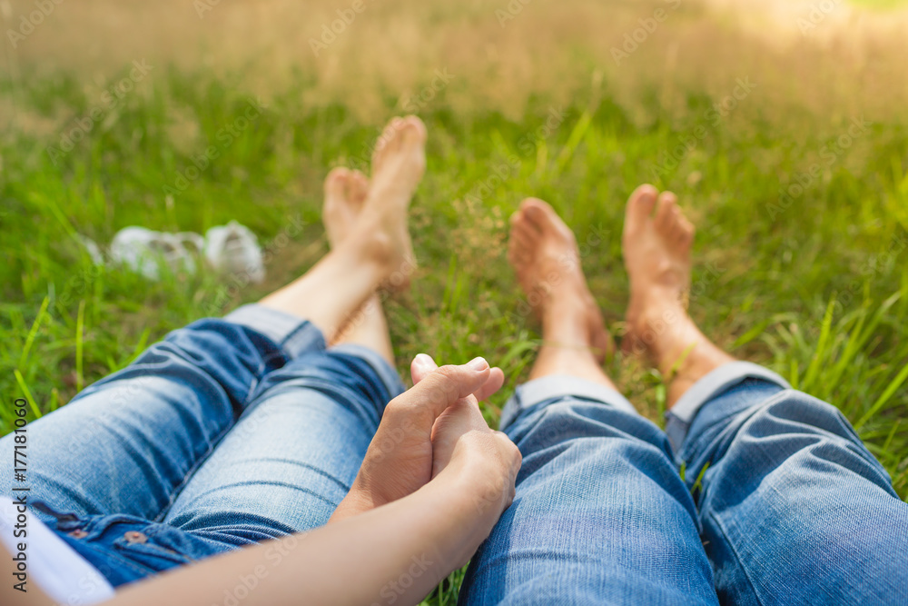 Sit back relax. Young couple relaxing at park Stock Photo | Adobe Stock