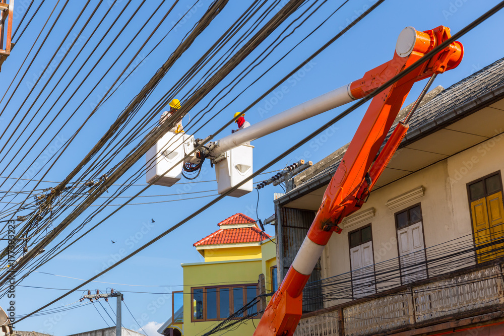 lineman duty working fix power line on electrical cable with aerial ...