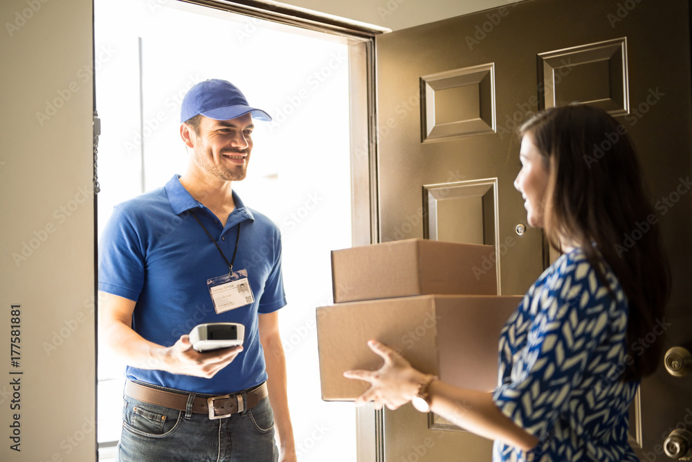 Delivery man getting a signature Stock Photo | Adobe Stock