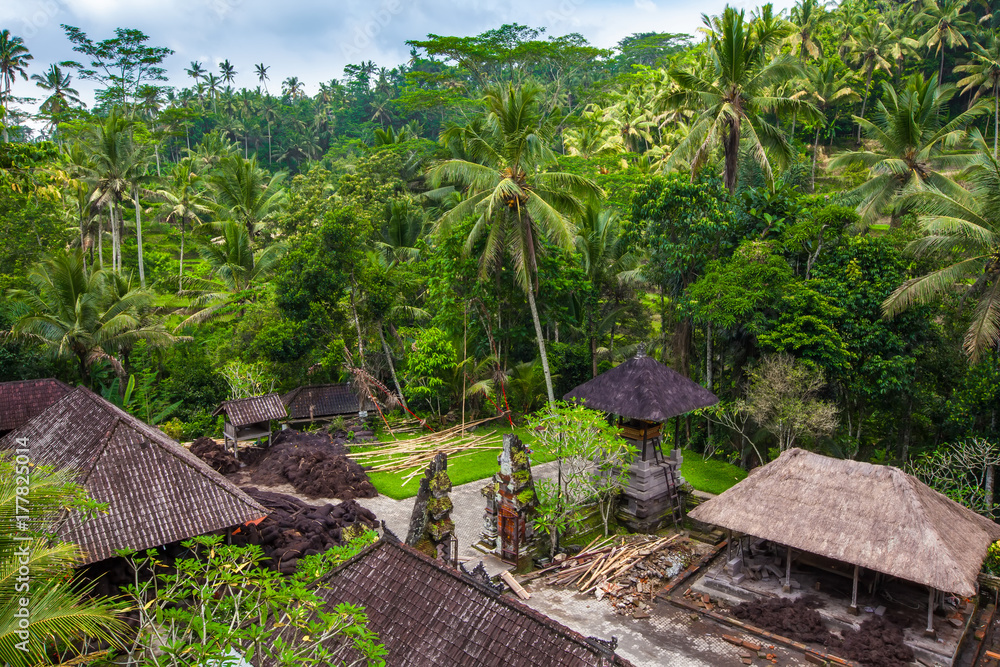 Traditional black roof Meru from coconut fiber. The courtyard of the ...