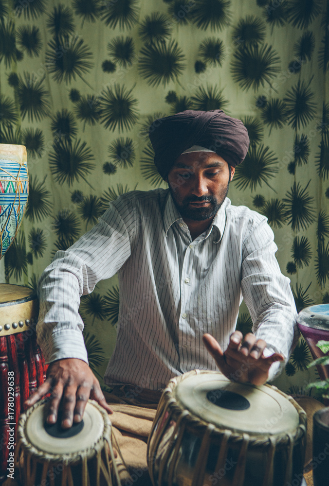 Indian man playing traditional indian drums Stock Photo | Adobe Stock