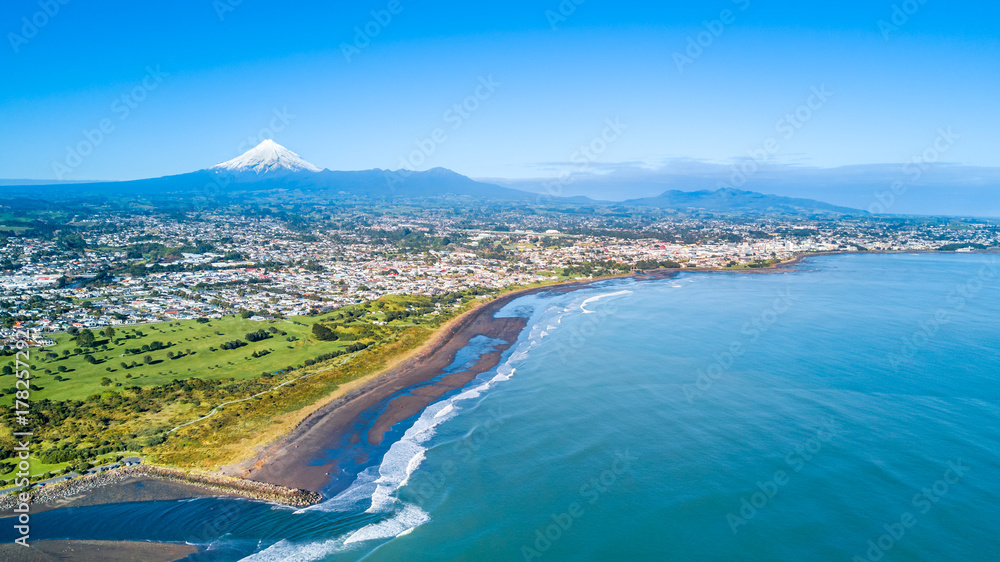 Aerial view on Taranaki coastline with a small river and New Plymouth ...