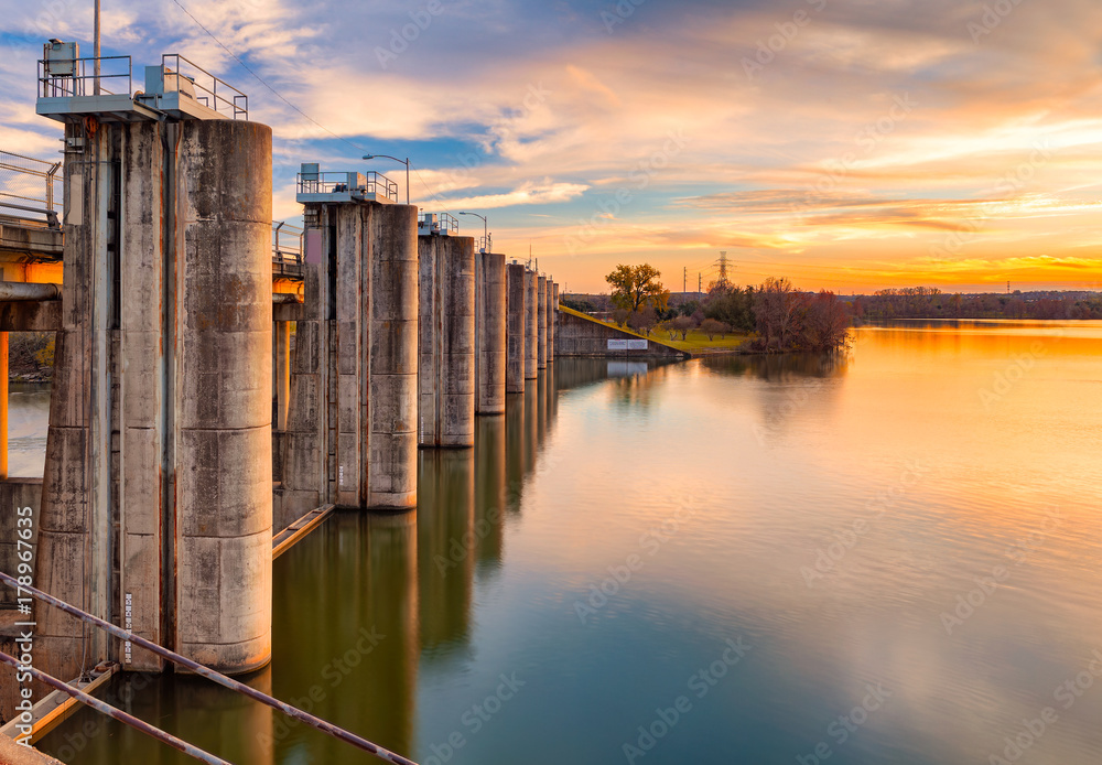 The sun sets over Longhorn Dam in Austin, Texas Stock Photo | Adobe Stock