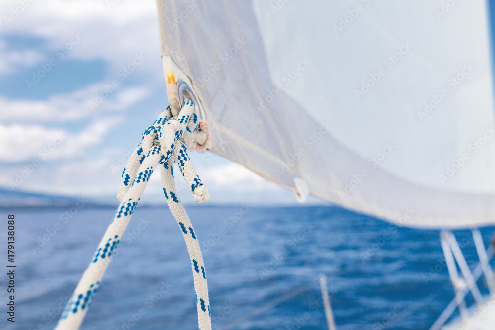 Foto de Stock Sail knot, jib, clew corner of the sail, white and blue ...
