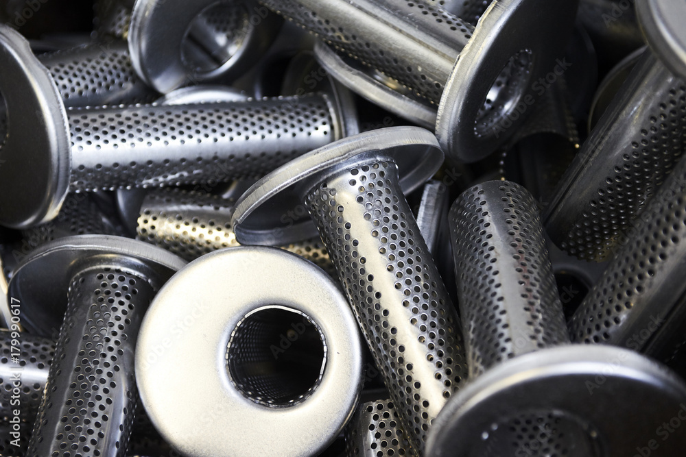 Foto de Stock Industrial background. Stacks of new exhausts and ...