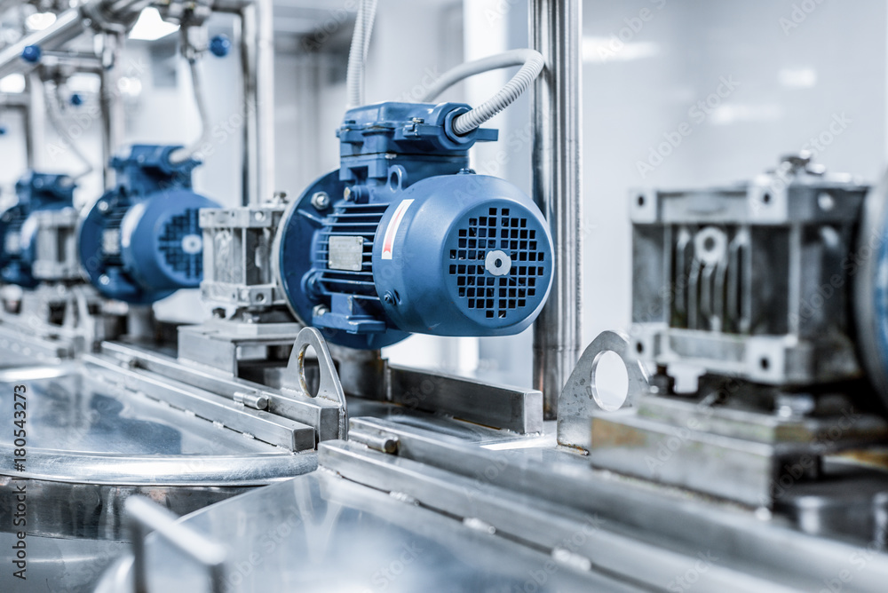 Electric motors on steel tanks for mixing liquids, modern production of ...