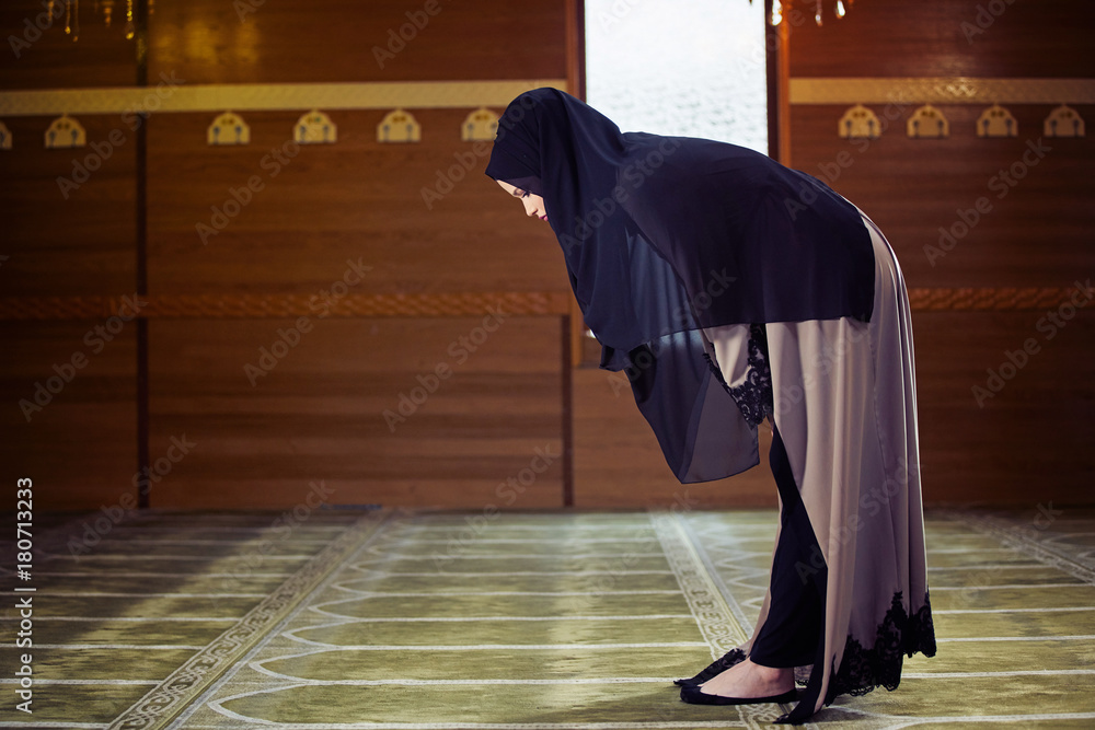 muslim woman praying in mosque Stock Photo | Adobe Stock