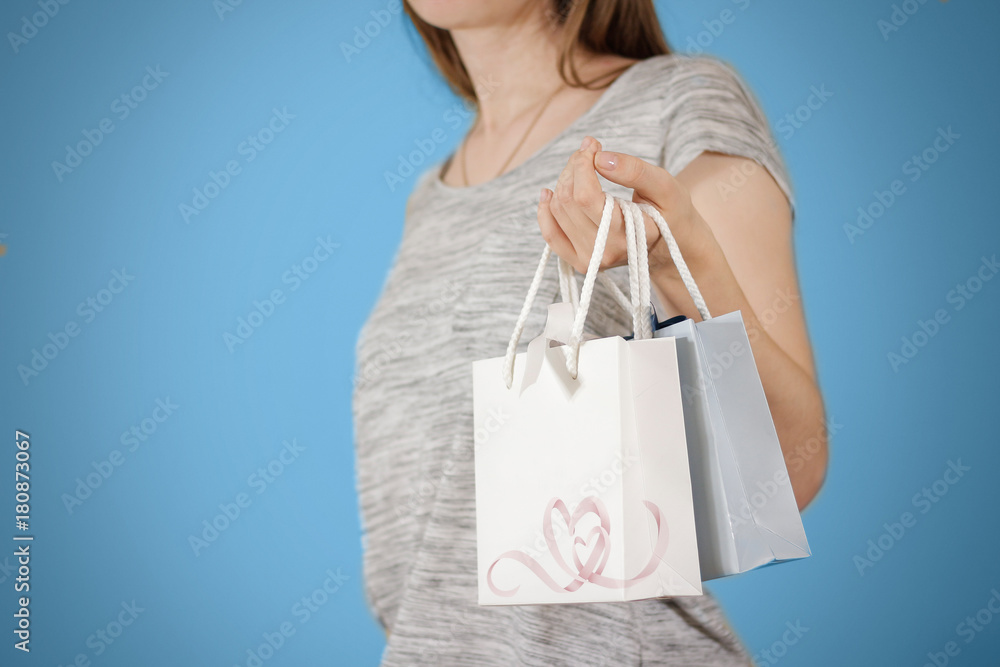 Girl holding in hand blank two paper gift bag with hearts mock up ...
