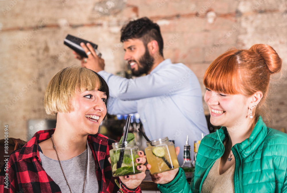 Couple of girlfriends having fun at fashion cocktail bar - Professional ...