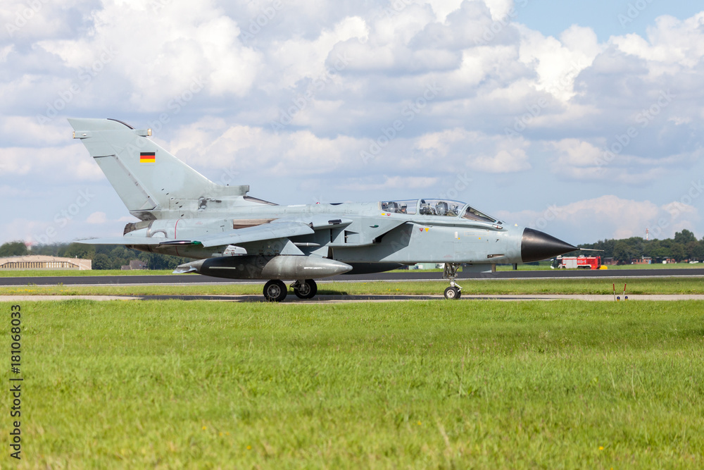 Photo Stock german jet fighter drives on military airbase | Adobe Stock