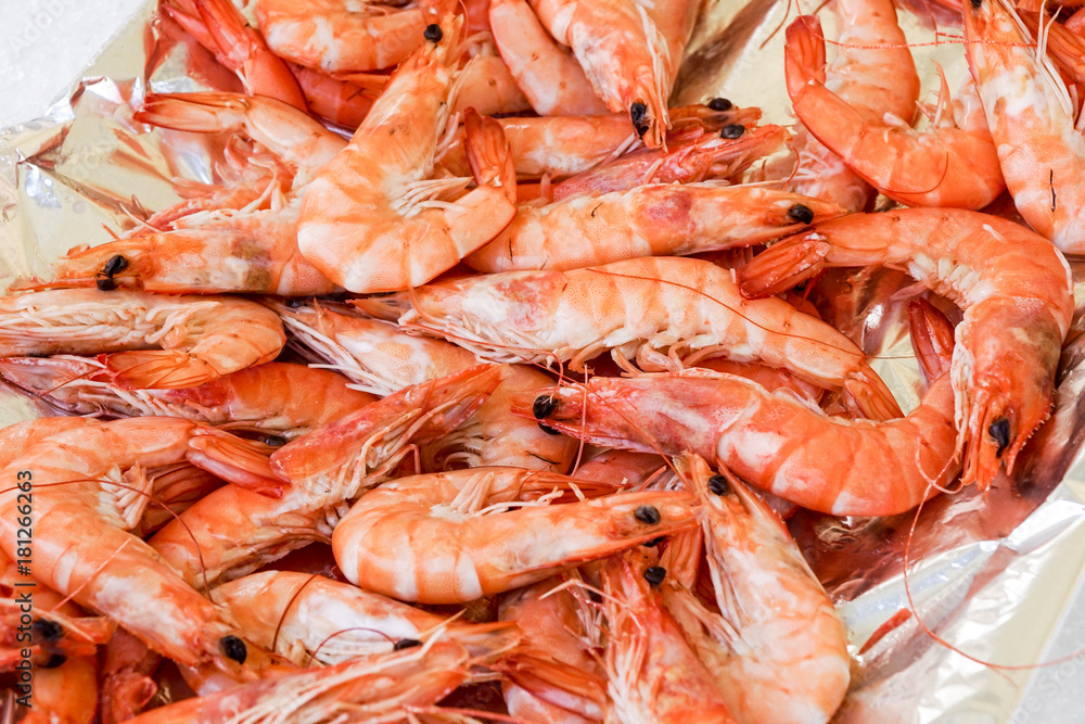Shrimp cocktail background with a close up view of a group of fresh ...