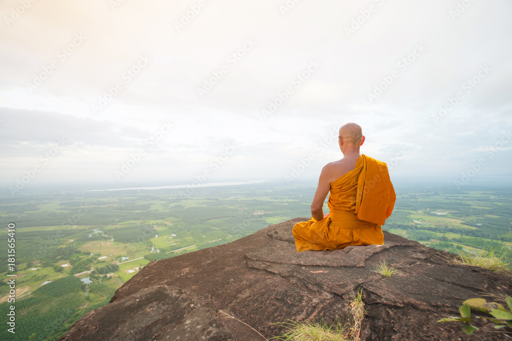 Buddhist monk in meditation at beautiful nature on high mountain Stock ...