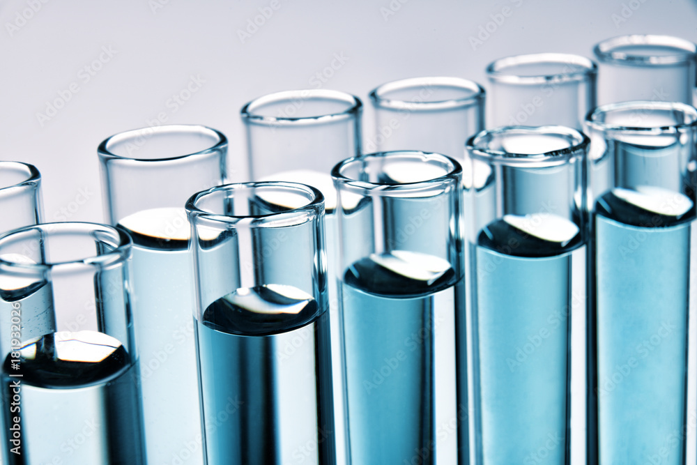 Row of full test tubes background Stock Photo | Adobe Stock