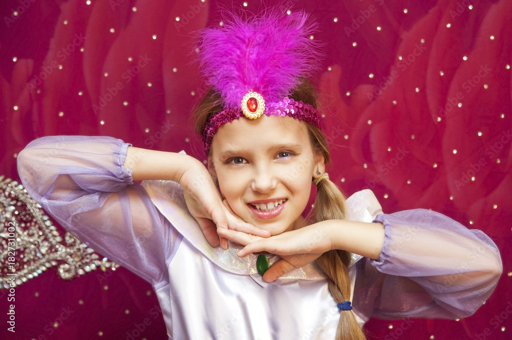 Young girl in a carnival costume of an East Asian princess on a red ...