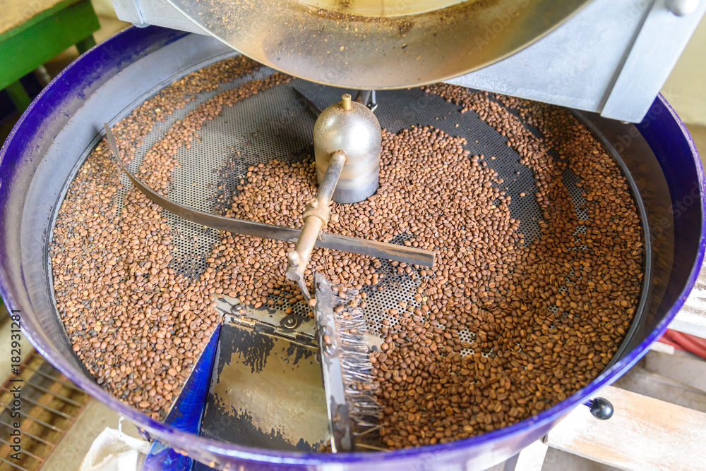 Coffee beans during the roasting process. Drum type roaster. Rosting ...