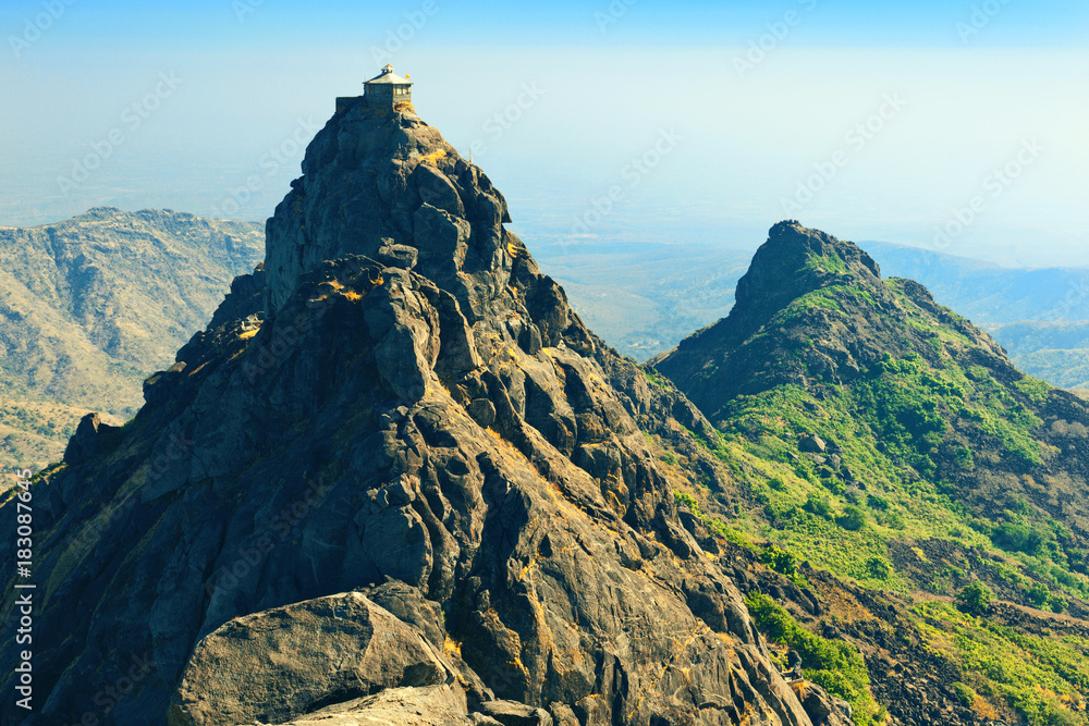 Hindu temple of Lord Dattatreya on top of Guru Dattatreya peak. Girnar ...