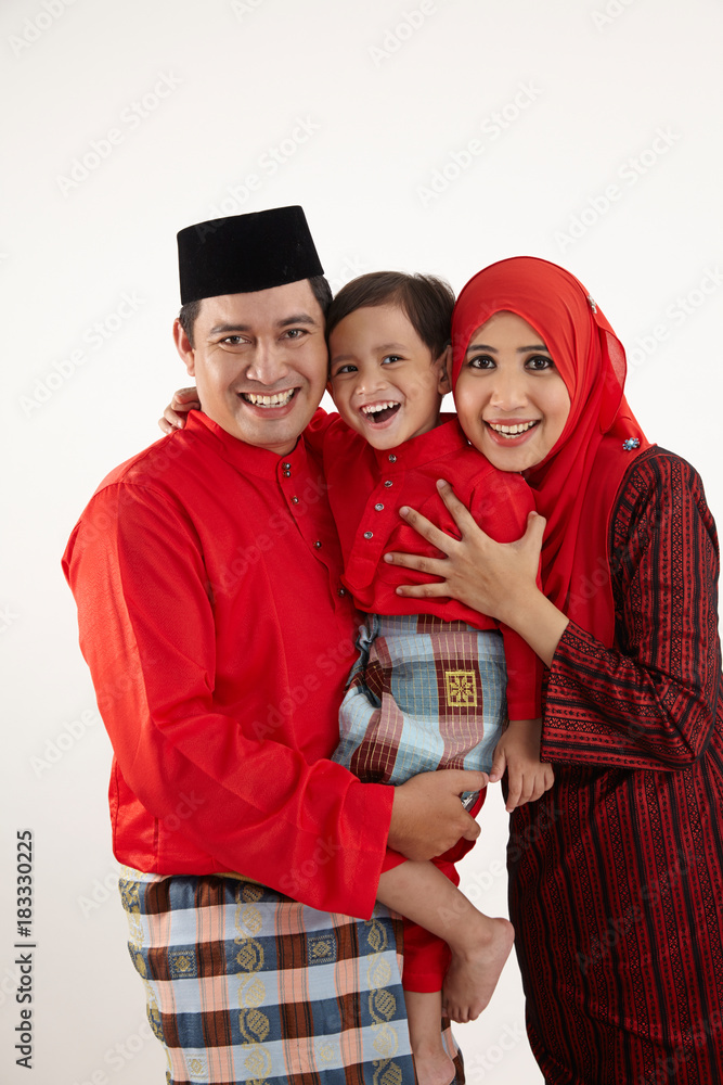 family in red baju raya Stock Photo | Adobe Stock