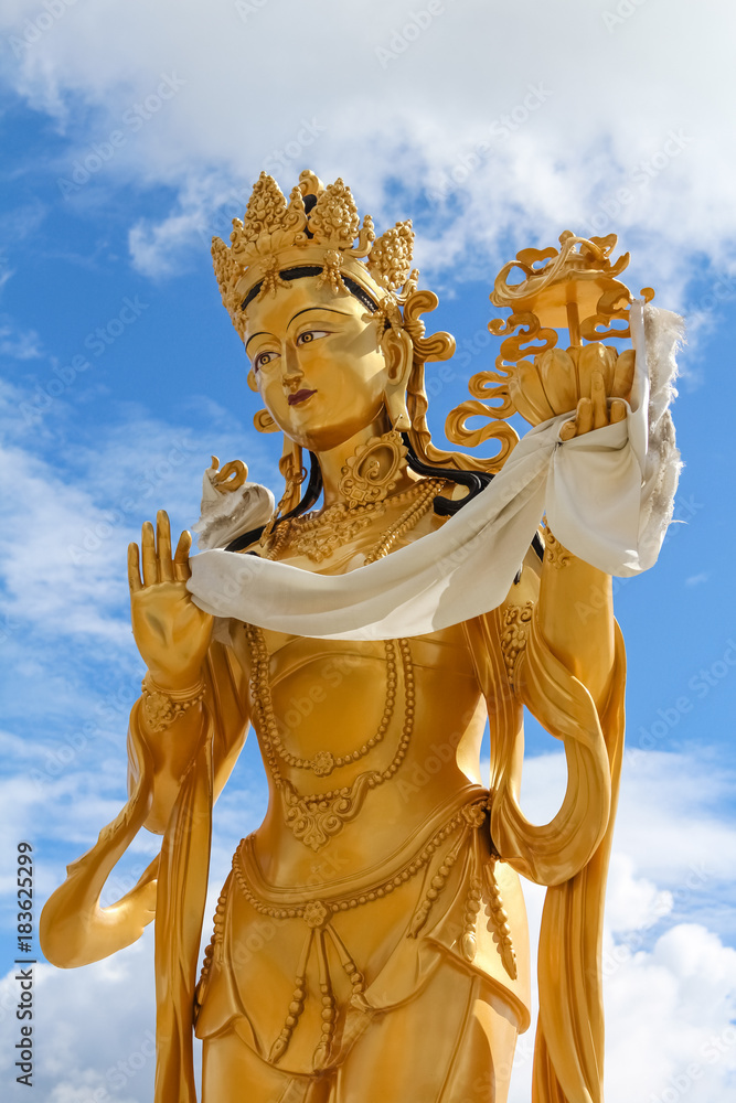 Golden statue of Buddhist Goddess at top hill in Kuensel Phodrang ...