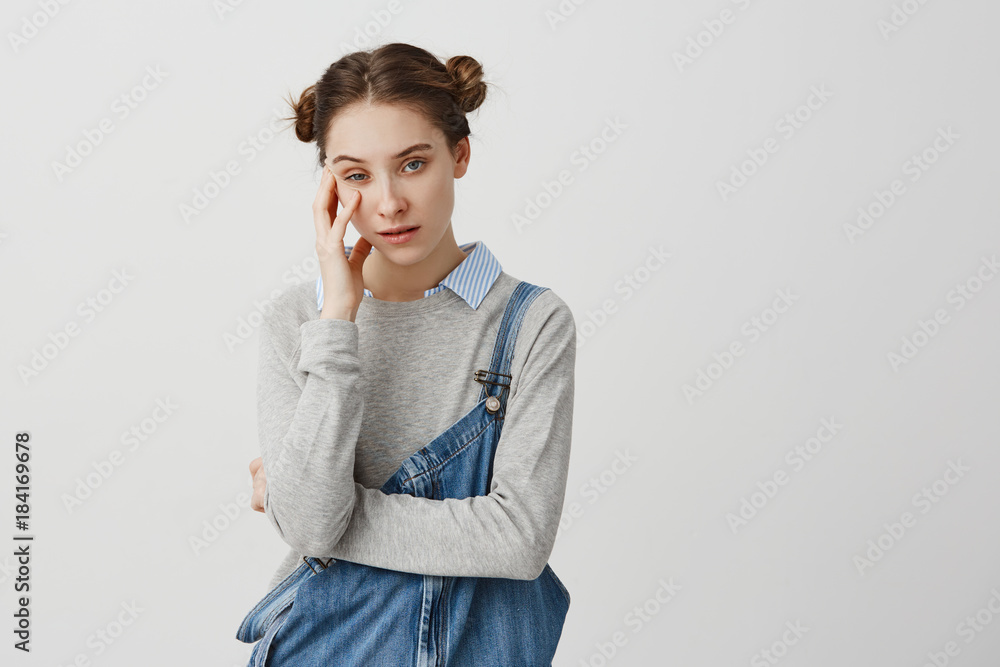 Lovely woman posing with annoyed look being fed up with someone holding ...