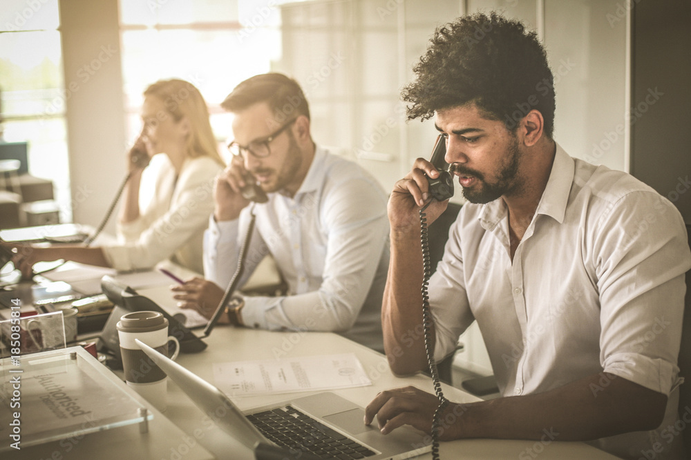 Stock-Foto „People in operations center talking on Landline phone ...