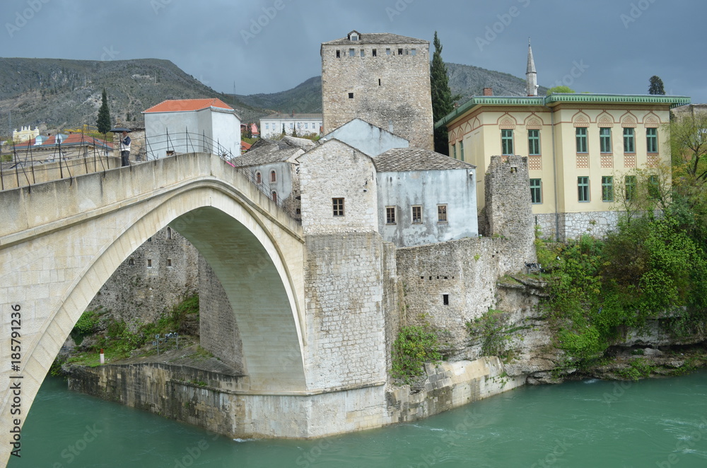 Stock-Foto „Mostar - Stari Most and Cezvan Cehaja's Mosque“ | Adobe Stock