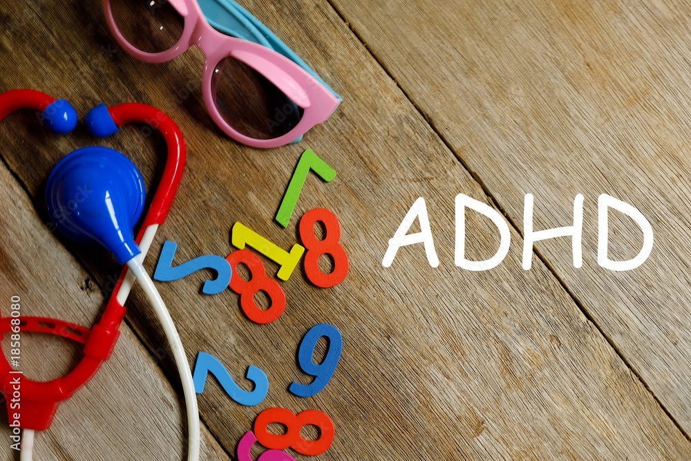 Top view of stethoscope.kids sunglasses,and wooden numbers on wooden ...