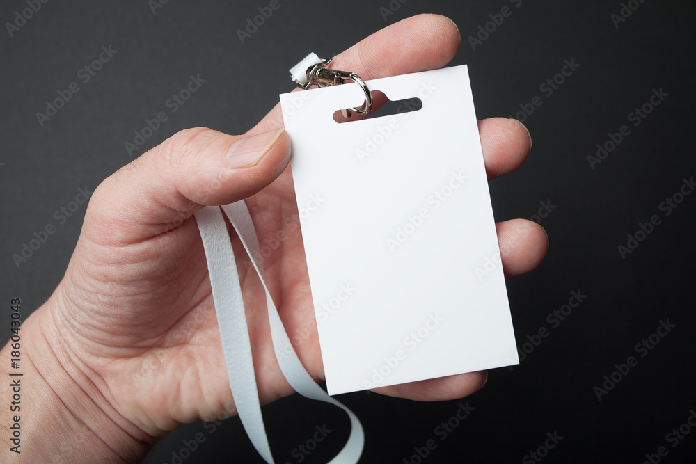 Close up, hand holding Identification white blank plastic id card ...