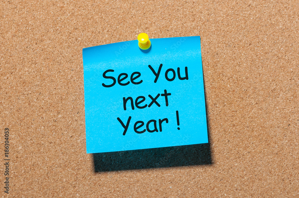 phrase See you next year pinned at cork board Stock Photo | Adobe Stock