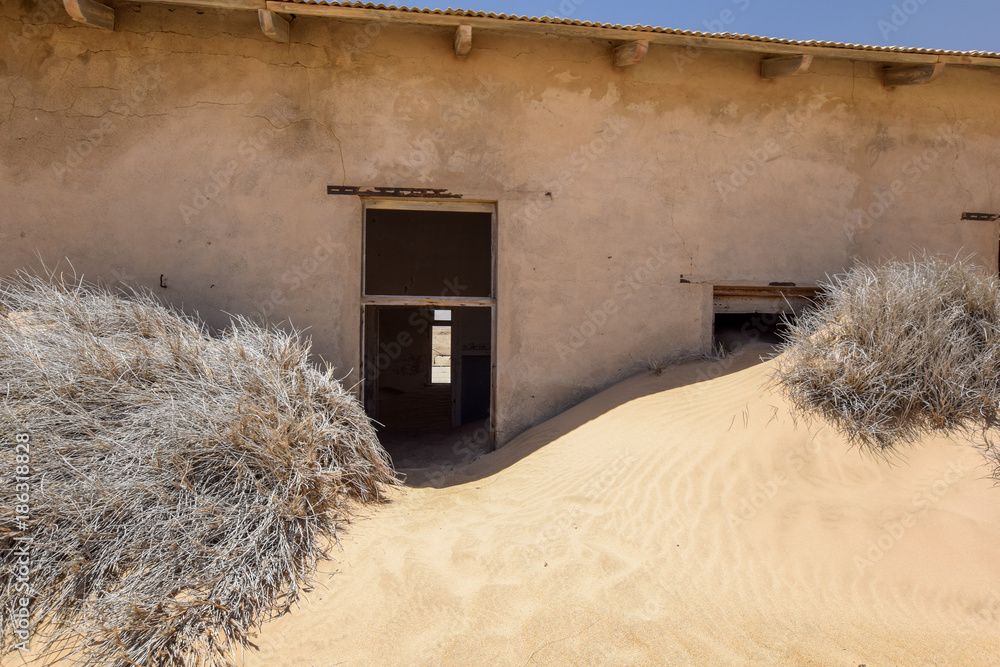 Outside view of one of the abandoned houses in the ghost town of ...