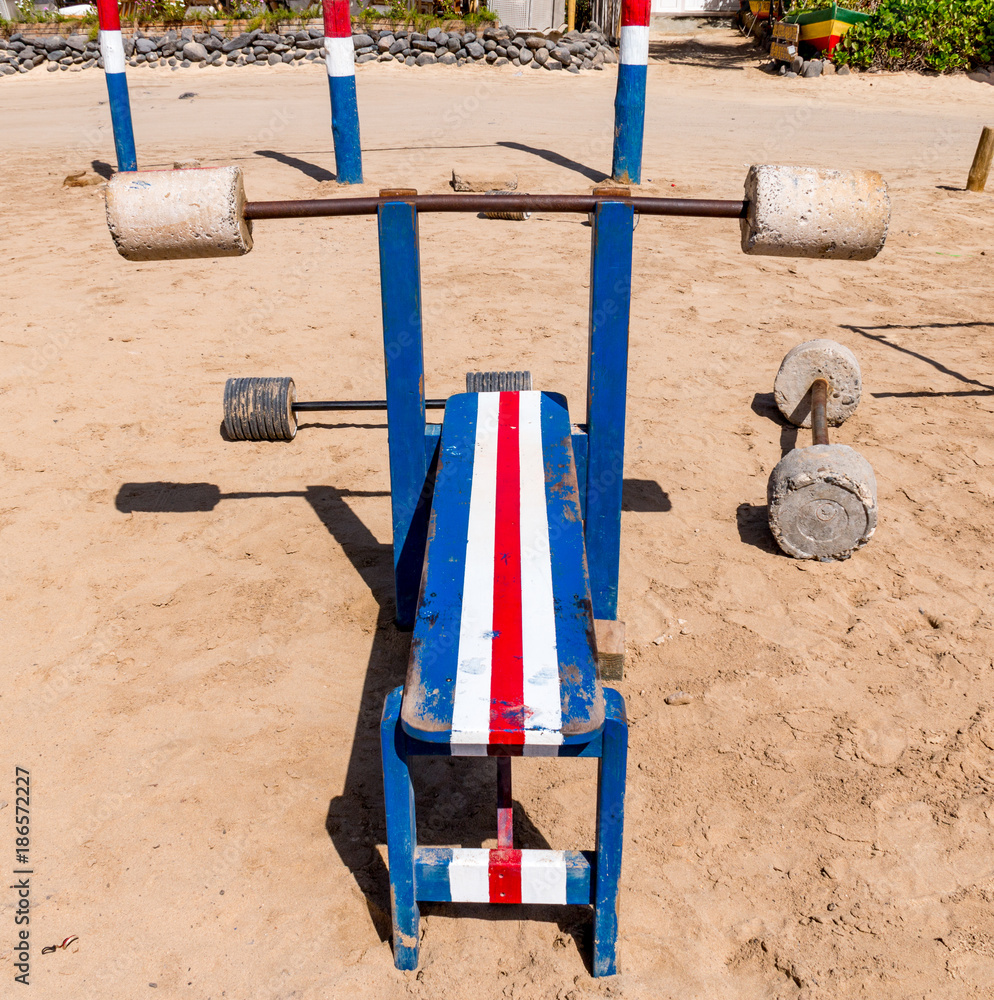 A basic Cabo Verde coloured bench press bench, with weights made out of ...