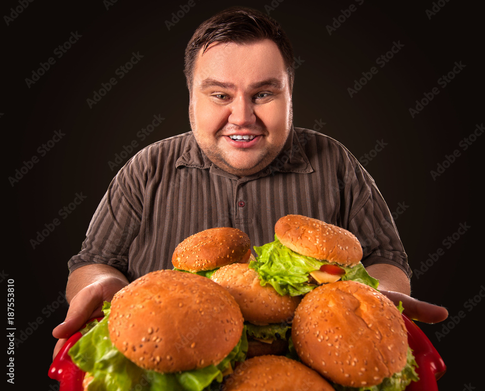 Foto Diet failure of fat man eating fast food. Happy smile overweight ...
