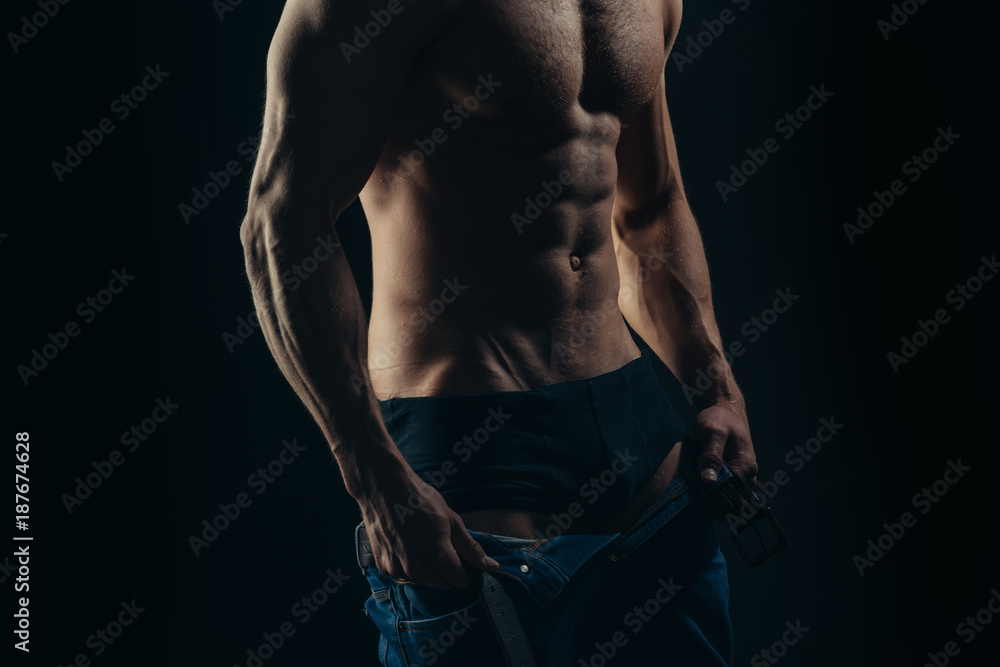 Muscular torso, chest, belly on black background Stock Photo | Adobe Stock