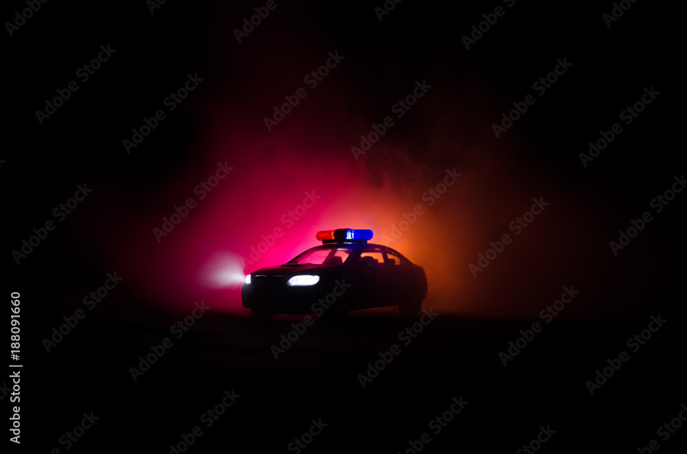 Police car chasing a car at night with fog background. 911 Emergency ...