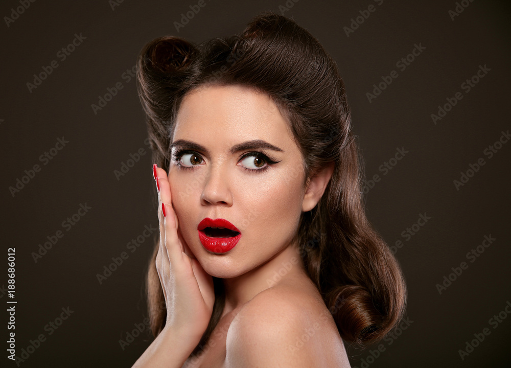 Surprised pin up girl holds cheek by hand. Comic woman with curls retro ...
