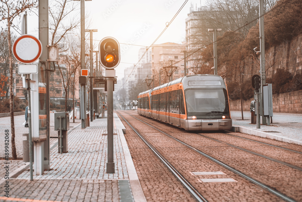 Outdoor subway stop with modern futuristic glossy metro train or tram ...