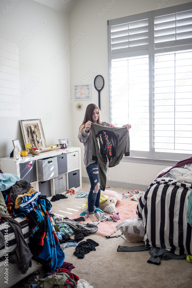 Teenage girl in messy room Stock Photo | Adobe Stock
