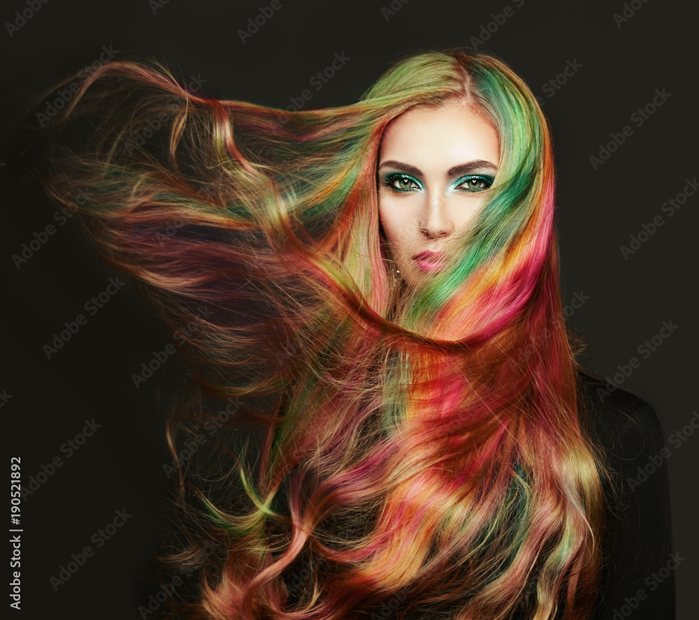 Portrait of young beautiful woman with long flowing hair. Model with ...