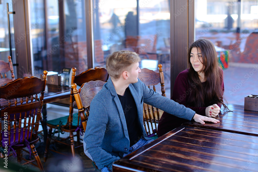 Boyfriend and girlfriend waiting for order in cafe and remembering ...