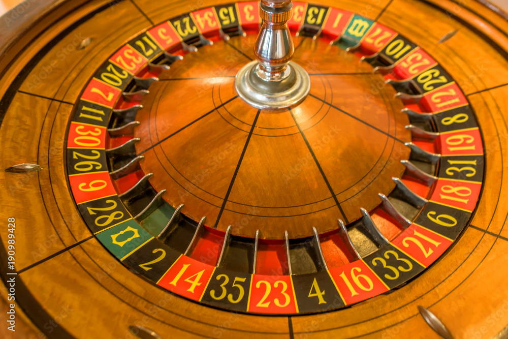 Round, wooden, wheel, roulettes with numbers in a circle of a wheel ...