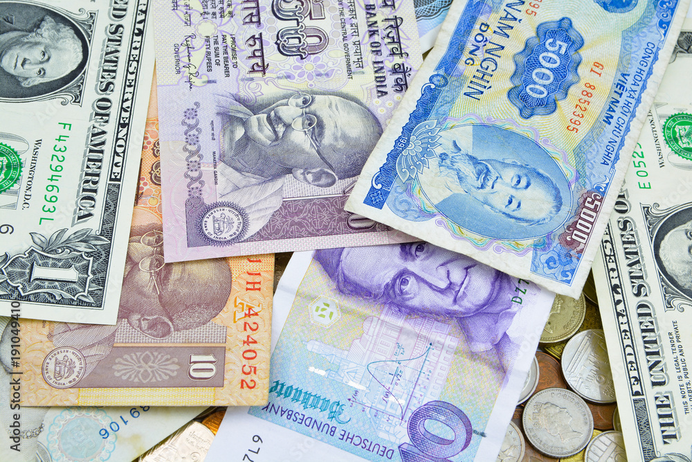 Paper and coin money of different countries of the world in the mix ...