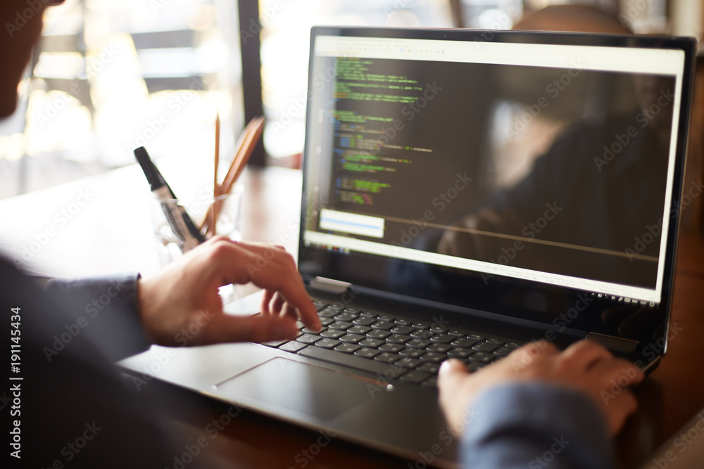 Photo Stock Back view over the shoulder shot of developer programmer ...